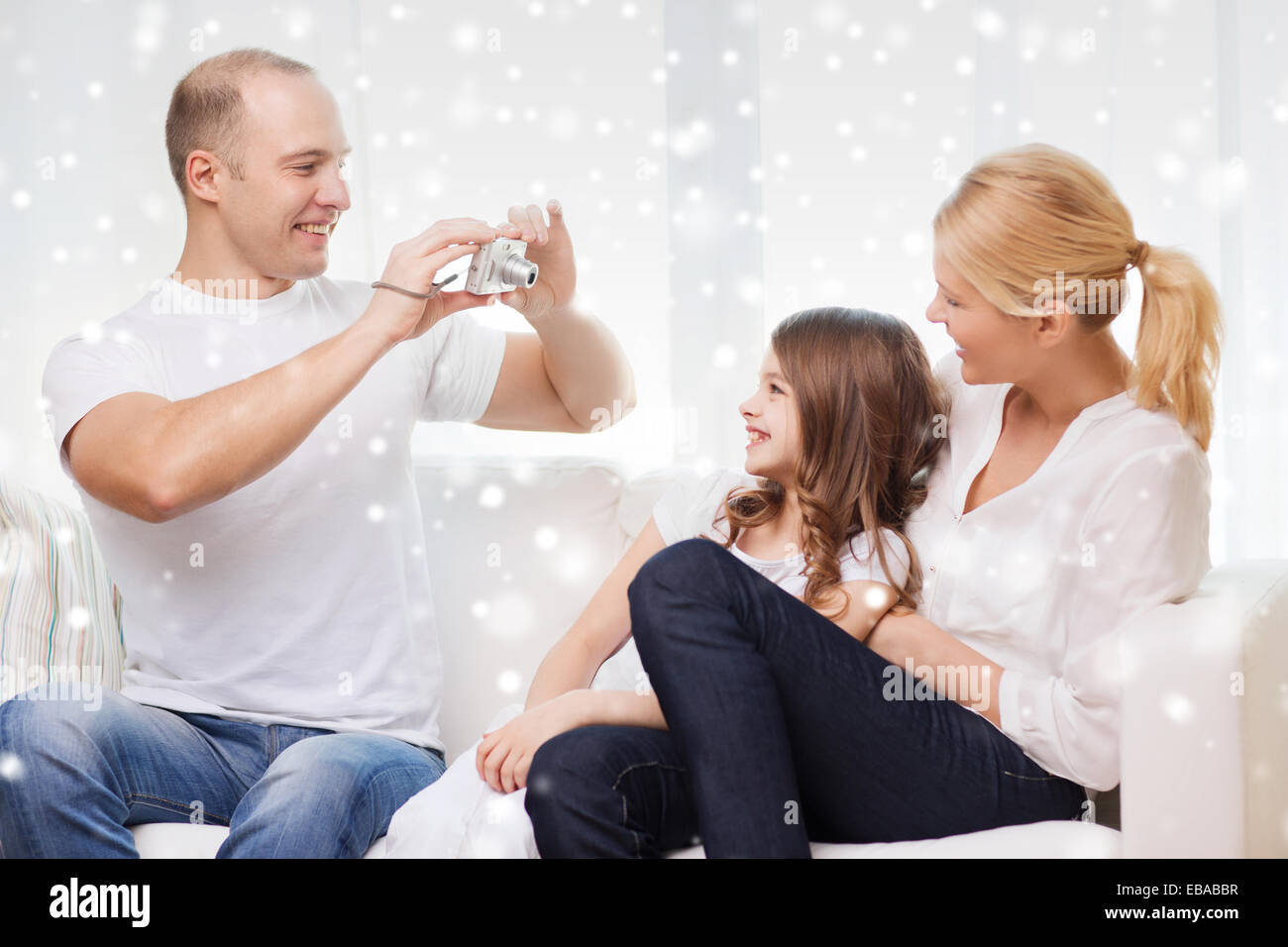 happy family with camera taking picture at home Stock Photo - Alamy