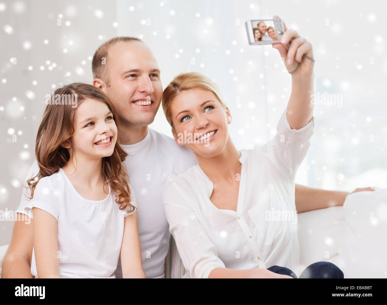 happy family with camera taking picture at home Stock Photo - Alamy