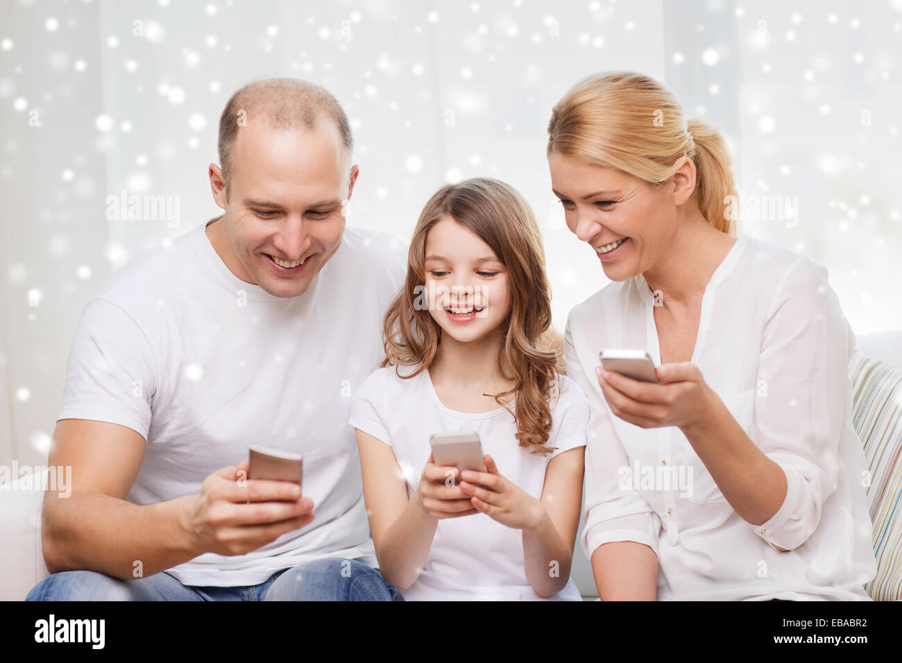 happy family with smartphones at home Stock Photo - Alamy