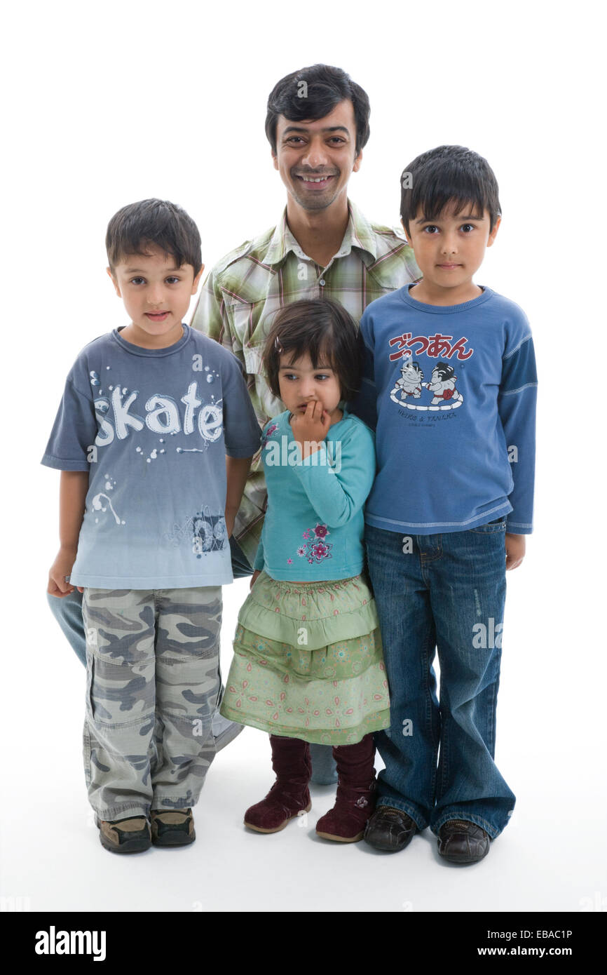 Portrait of a father with his children in the studio Stock Photo - Alamy