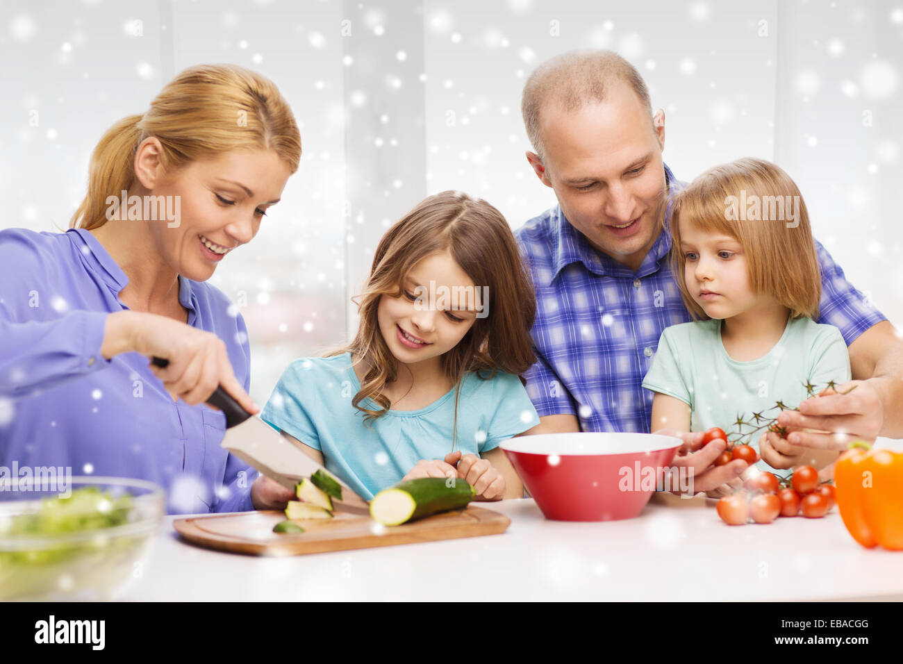 happy family with two kids making dinner at home Stock Photo - Alamy