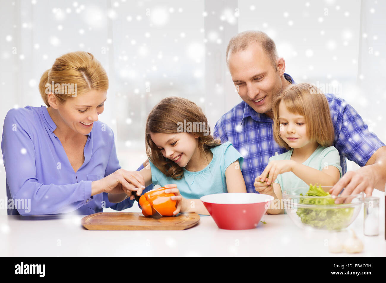 happy family with two kids making dinner at home Stock Photo - Alamy