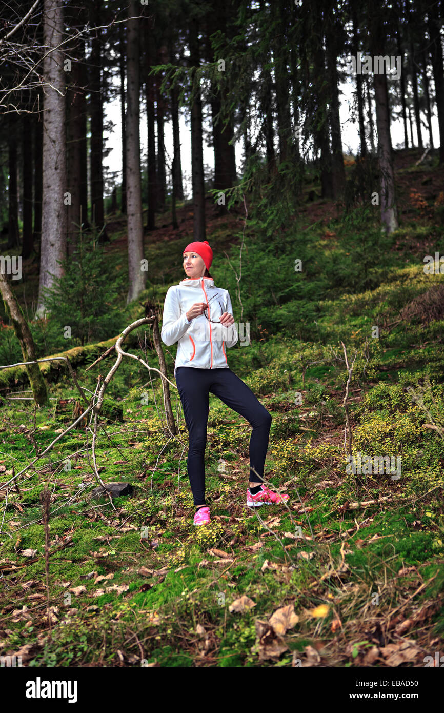 woman running through the forest by the lake Stock Photo - Alamy