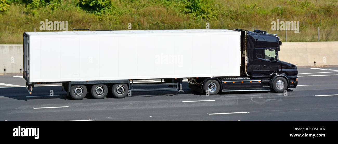 Black articulated lorry hi-res stock photography and images - Alamy