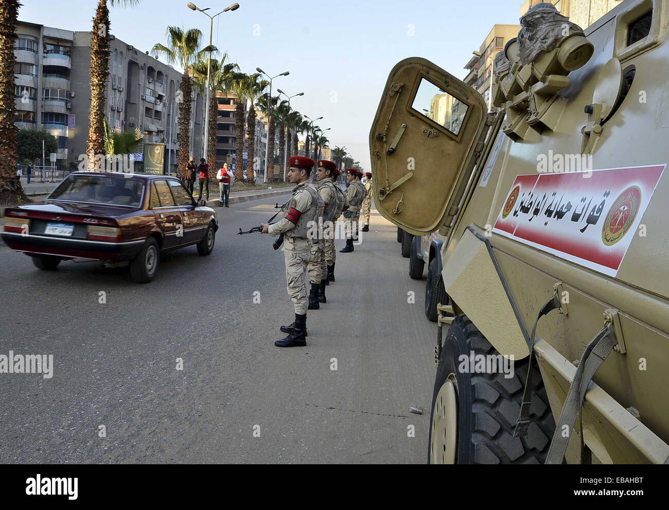 Cairo, Egypt. 28th Nov, 2014. Egyptian security forces stand guard in ...