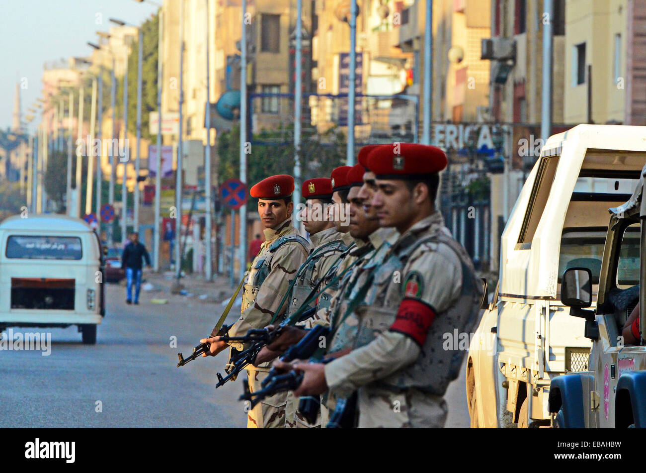 Cairo, Egypt. 28th Nov, 2014. Egyptian security forces stand guard in ...