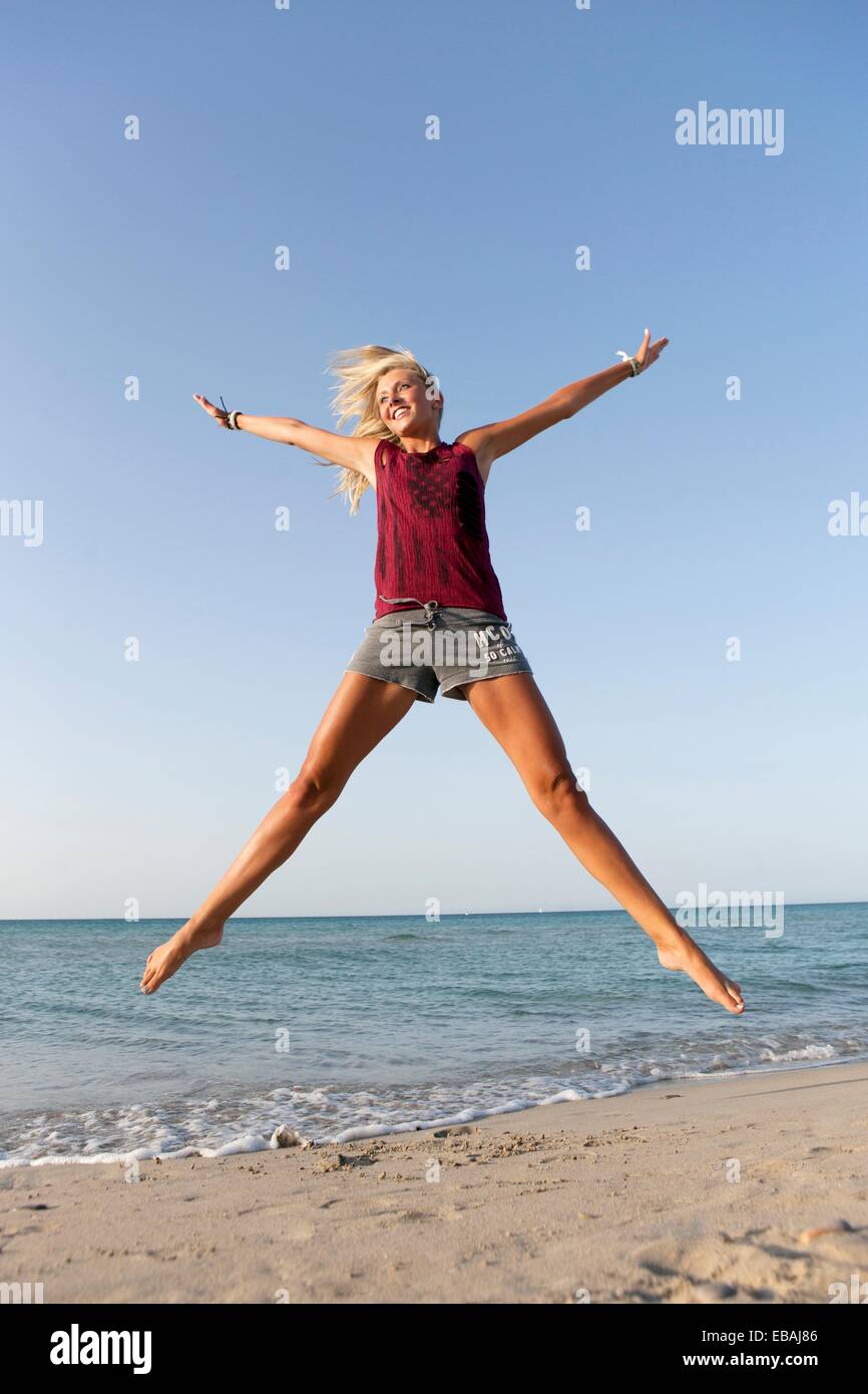 Woman star jump one person hi-res stock photography and images - Alamy