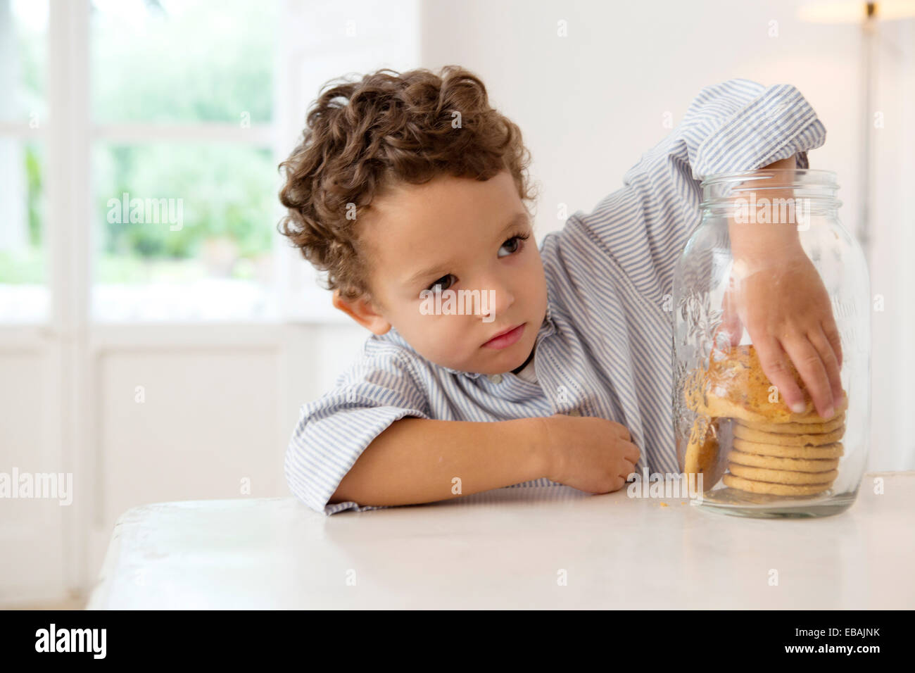 Hand in cookie jar hi-res stock photography and images - Alamy