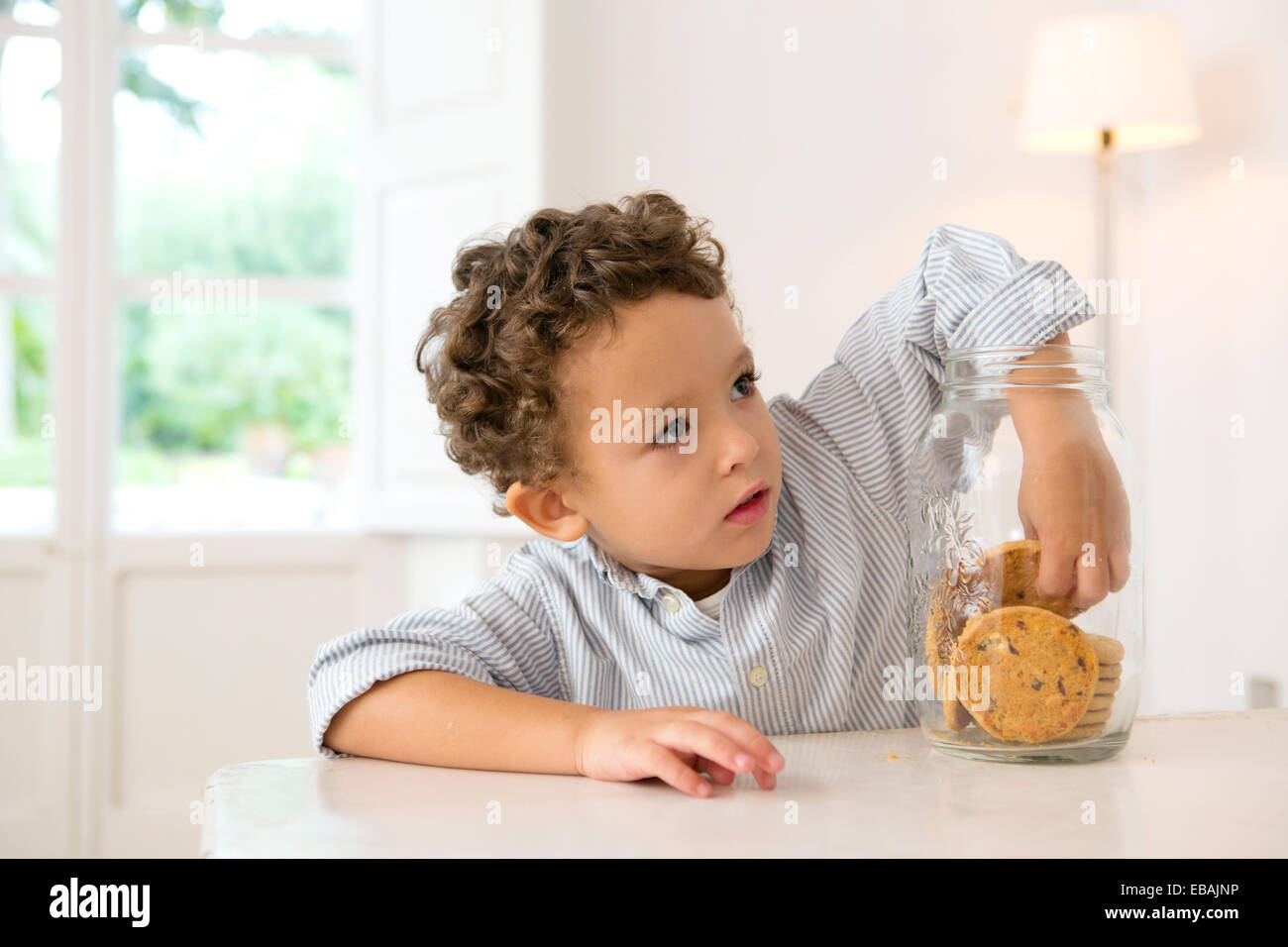 Hand in cookie jar hi-res stock photography and images - Alamy