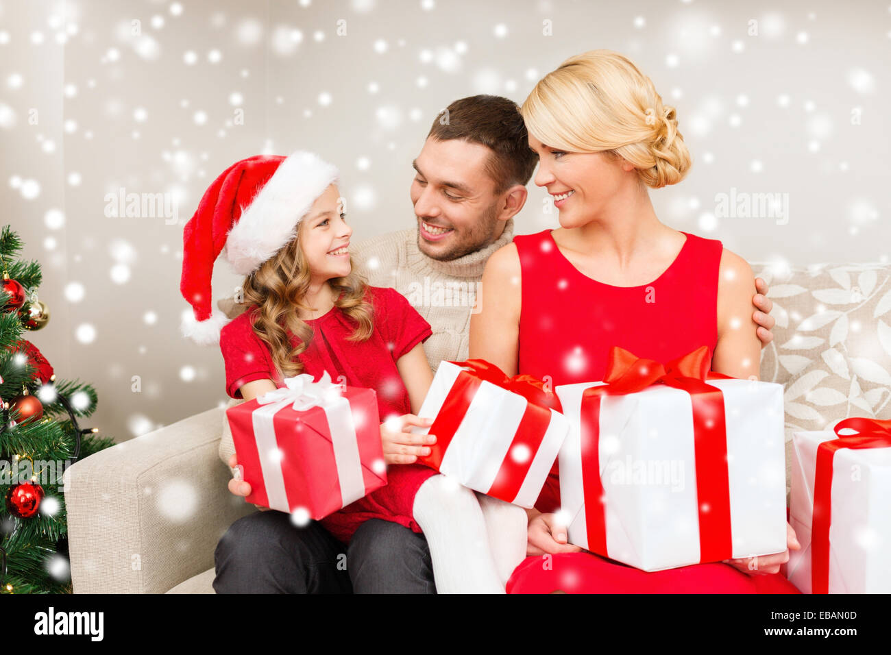 smiling family holding many gift boxes Stock Photo - Alamy