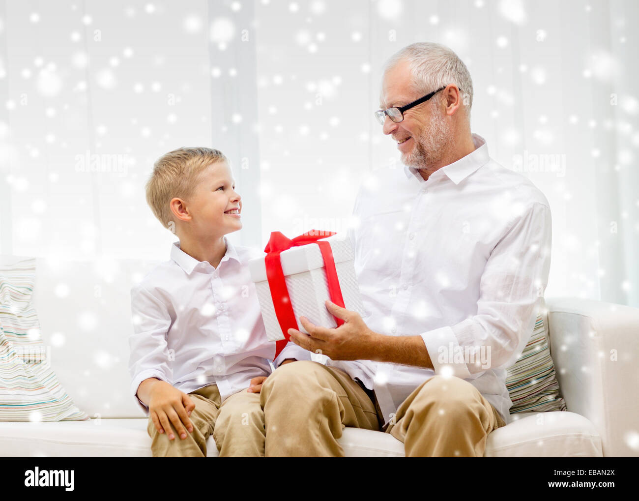 smiling grandfather and grandson at home Stock Photo - Alamy