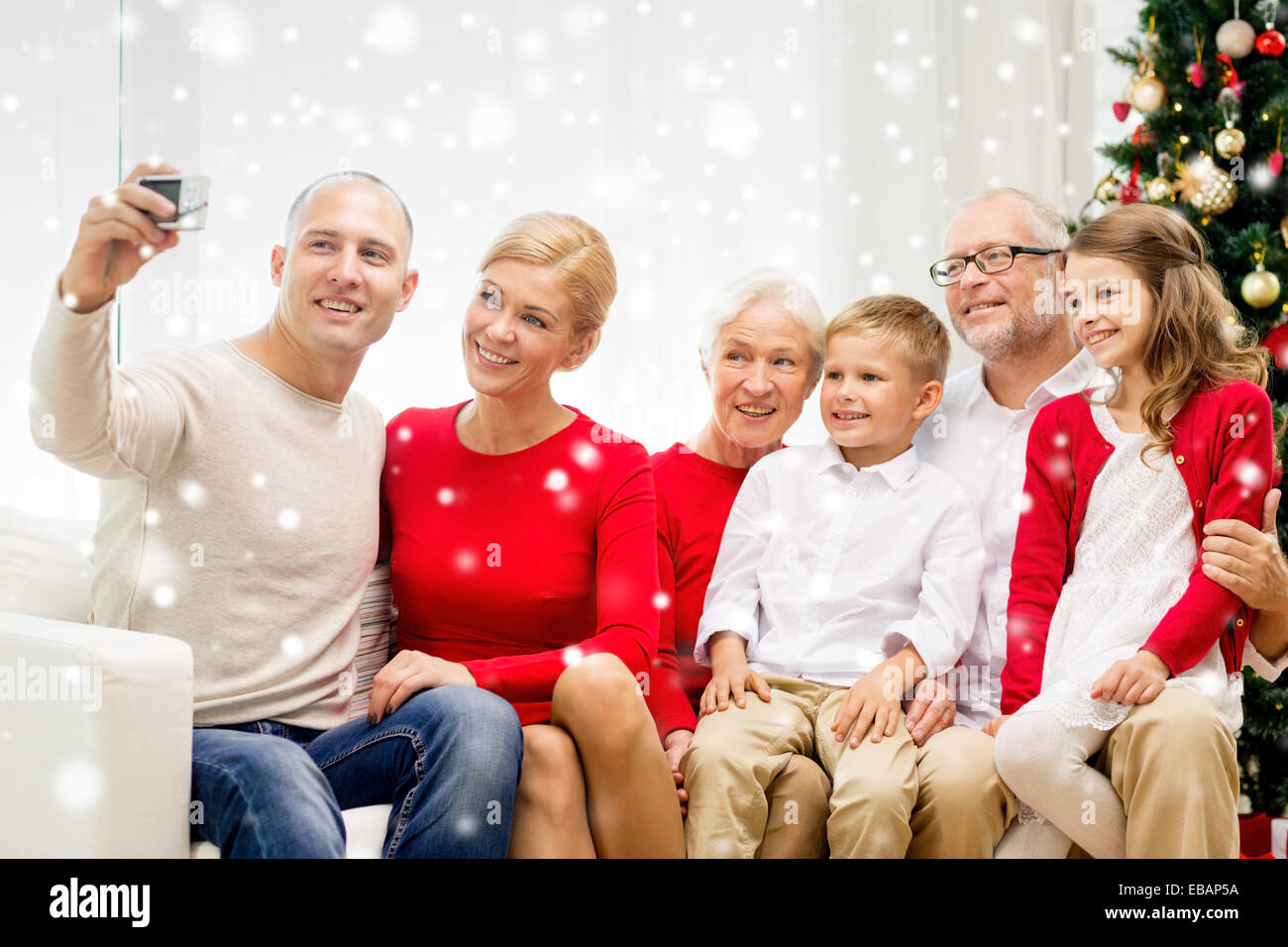 smiling family with camera at home Stock Photo - Alamy