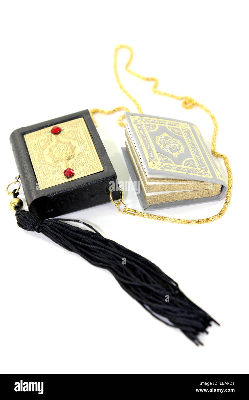 small Quran with Case before light background Stock Photo - Alamy