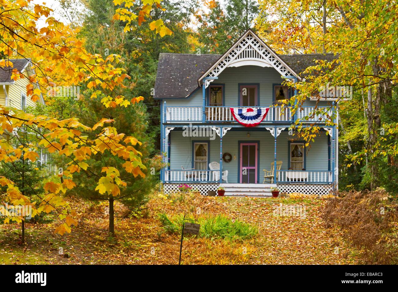 A Colonial home with fall foliage color in Petoskey, Michigan, USA ...