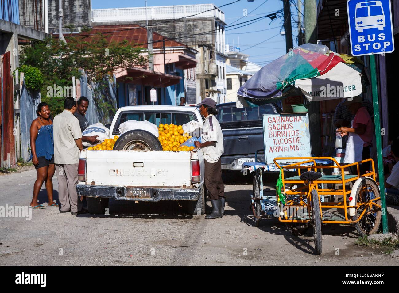 Buying and selling on the streets of Belize City Belize Stock Photo - Alamy
