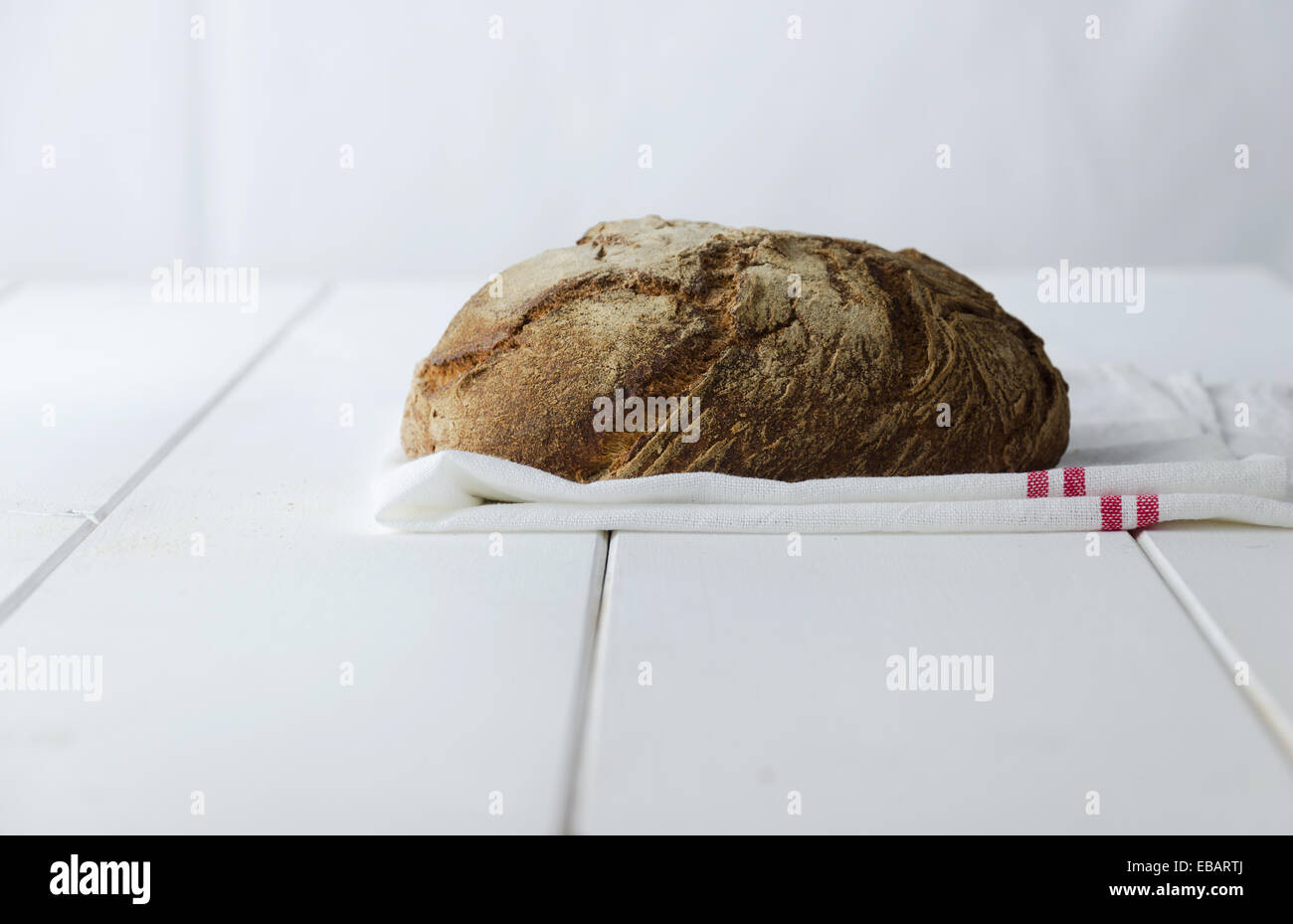 Traditional bread over white wooden table Stock Photo - Alamy