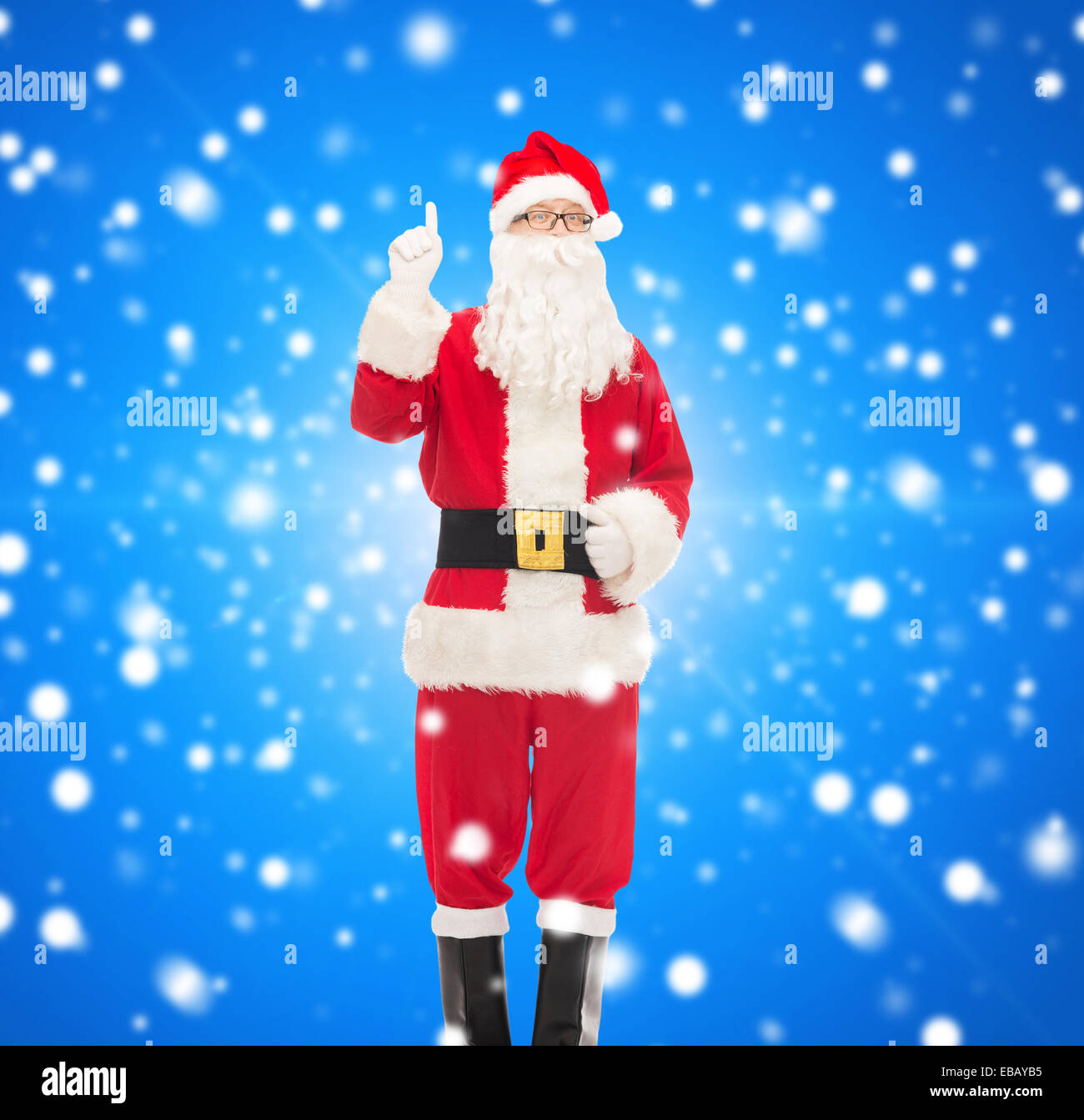 man in costume of santa claus pointing finger up Stock Photo - Alamy
