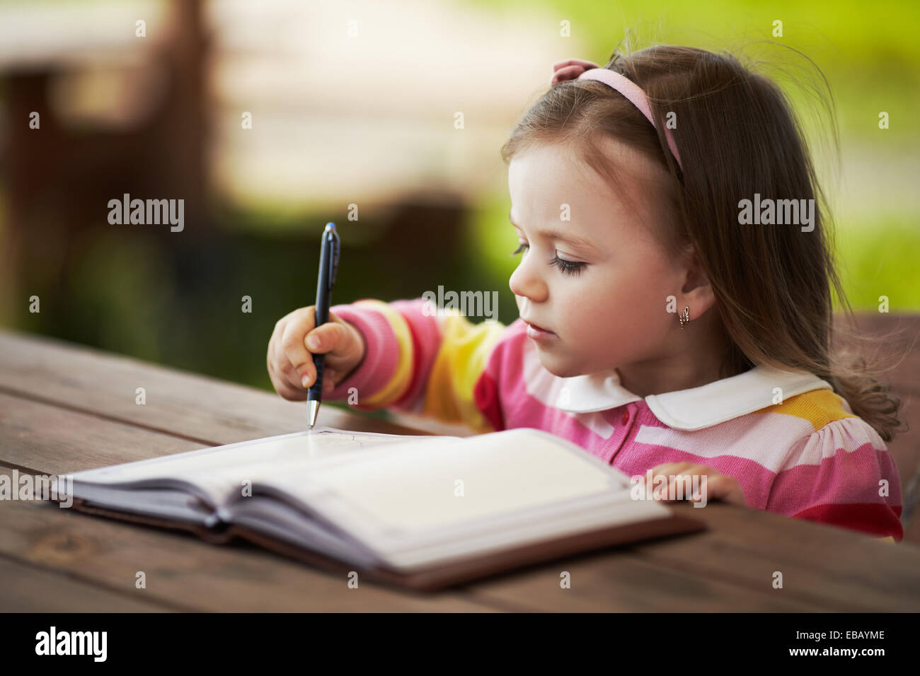 cute little girl learning to write Stock Photo - Alamy
