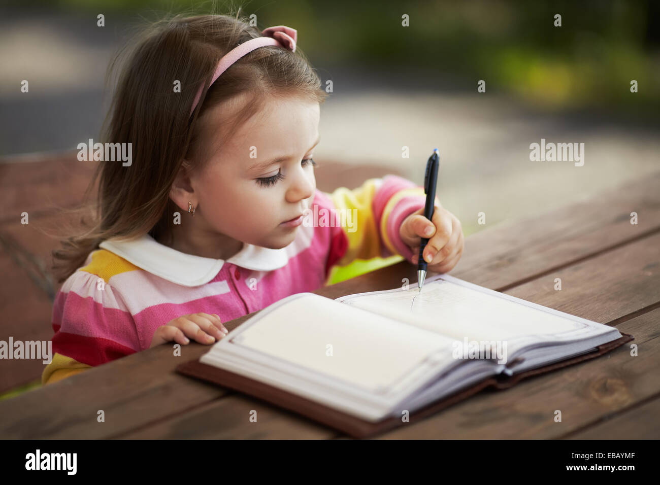 cute little girl learning to write Stock Photo - Alamy