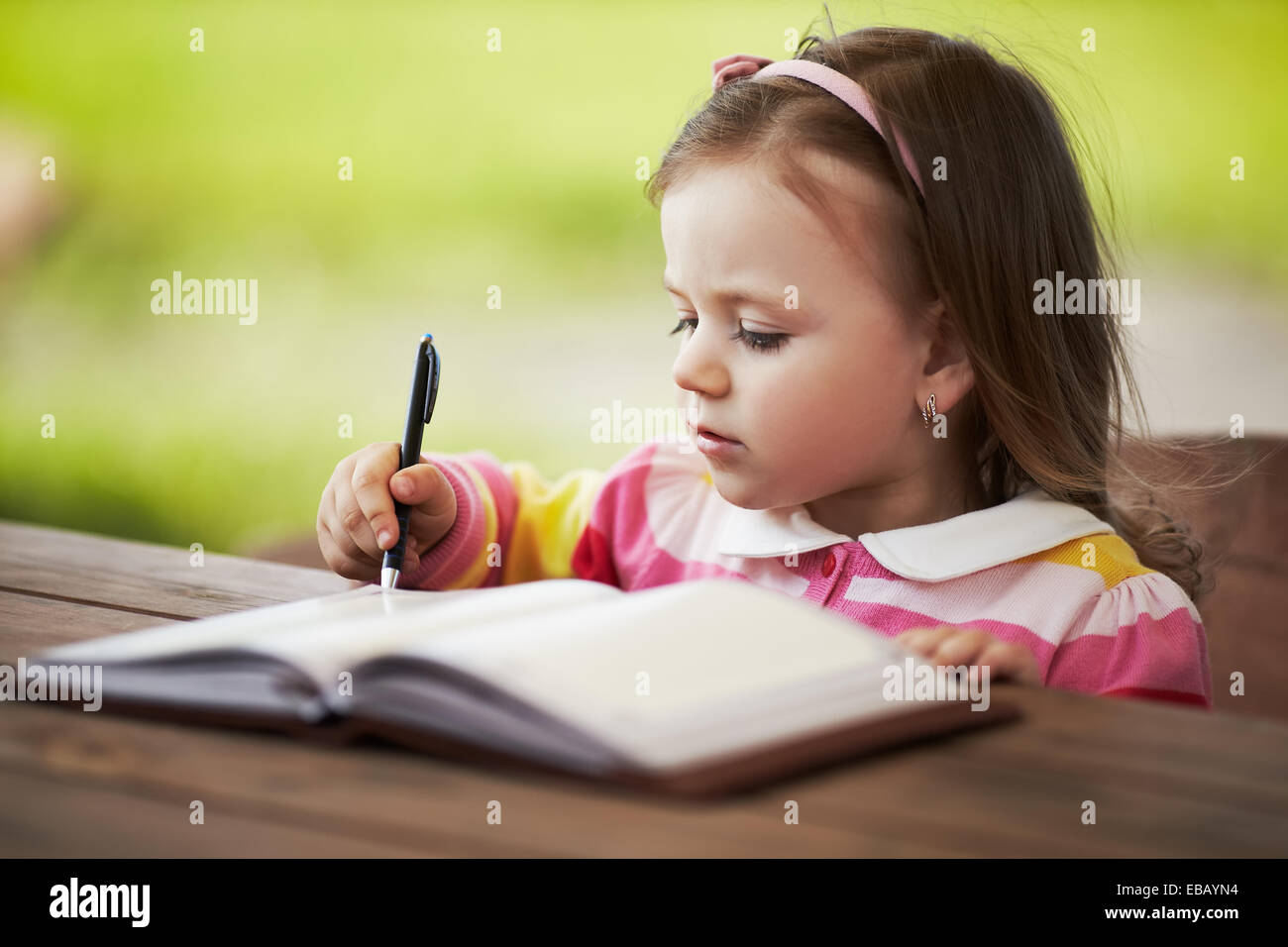 cute little girl learning to write Stock Photo - Alamy