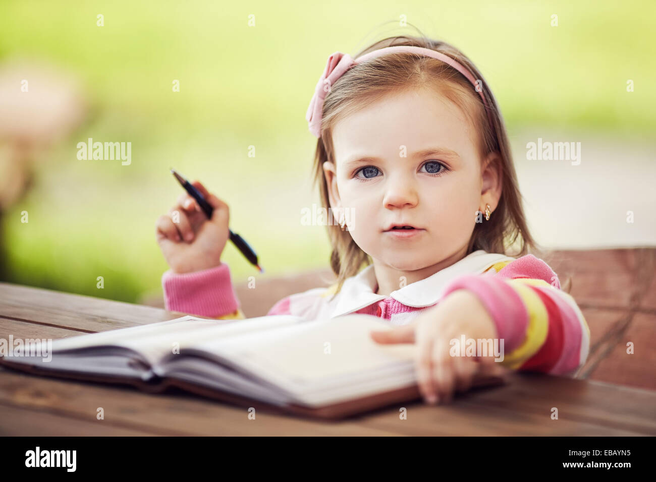 cute little girl learning to write Stock Photo - Alamy