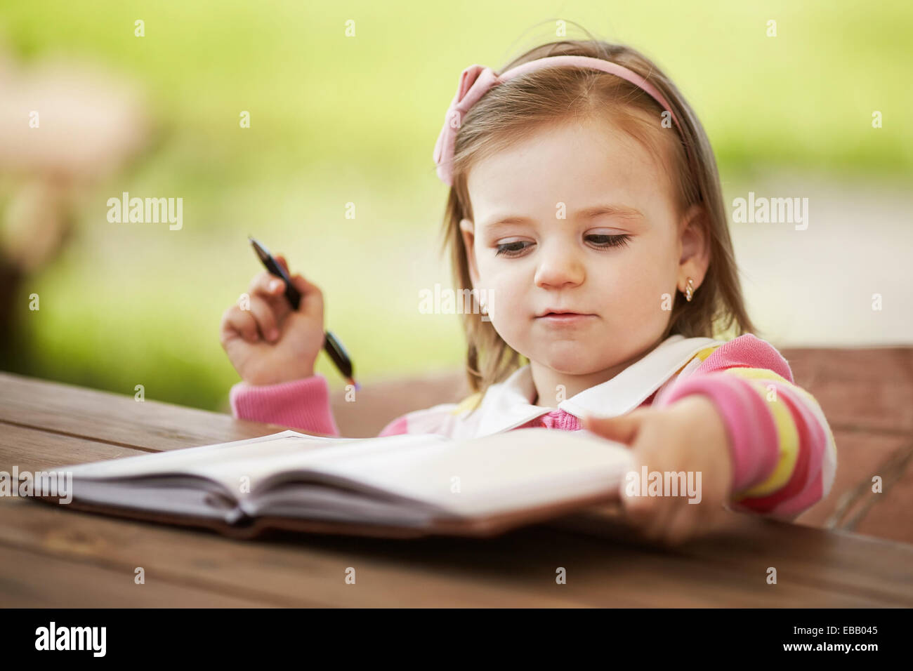 cute little girl learning to write Stock Photo - Alamy
