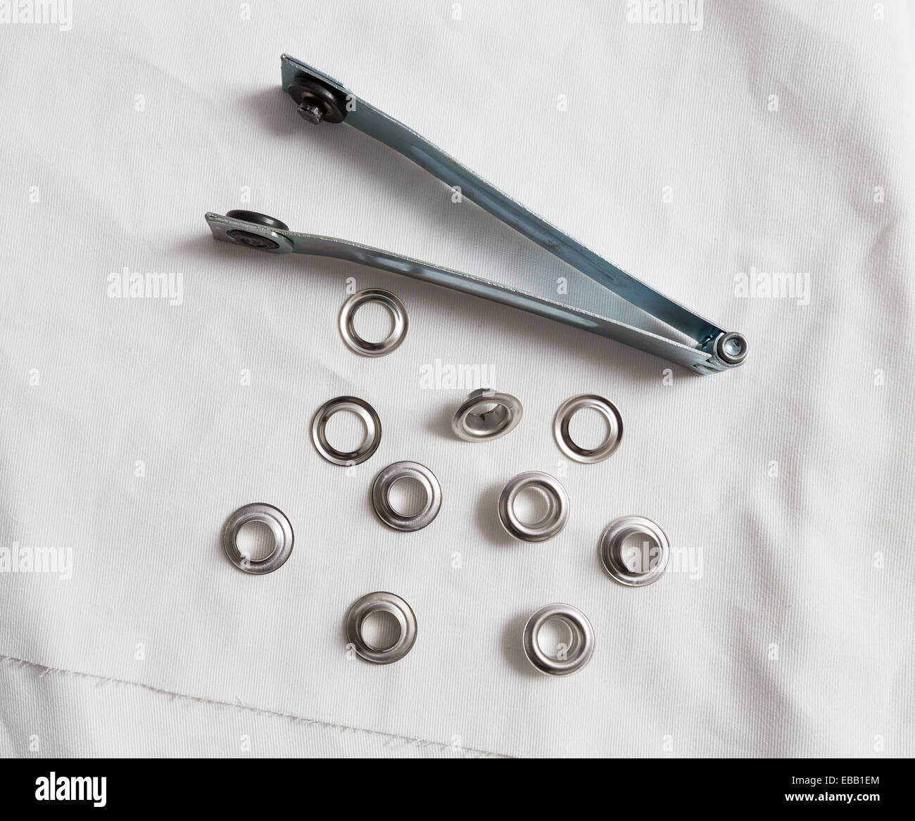 Rivets on light white cloth Stock Photo - Alamy