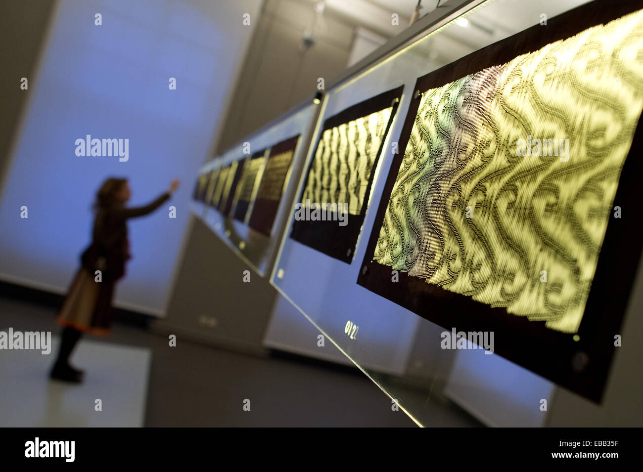 Dresden, Germany. 28th Nov, 2014. A woman looks at katagamis in the new ...