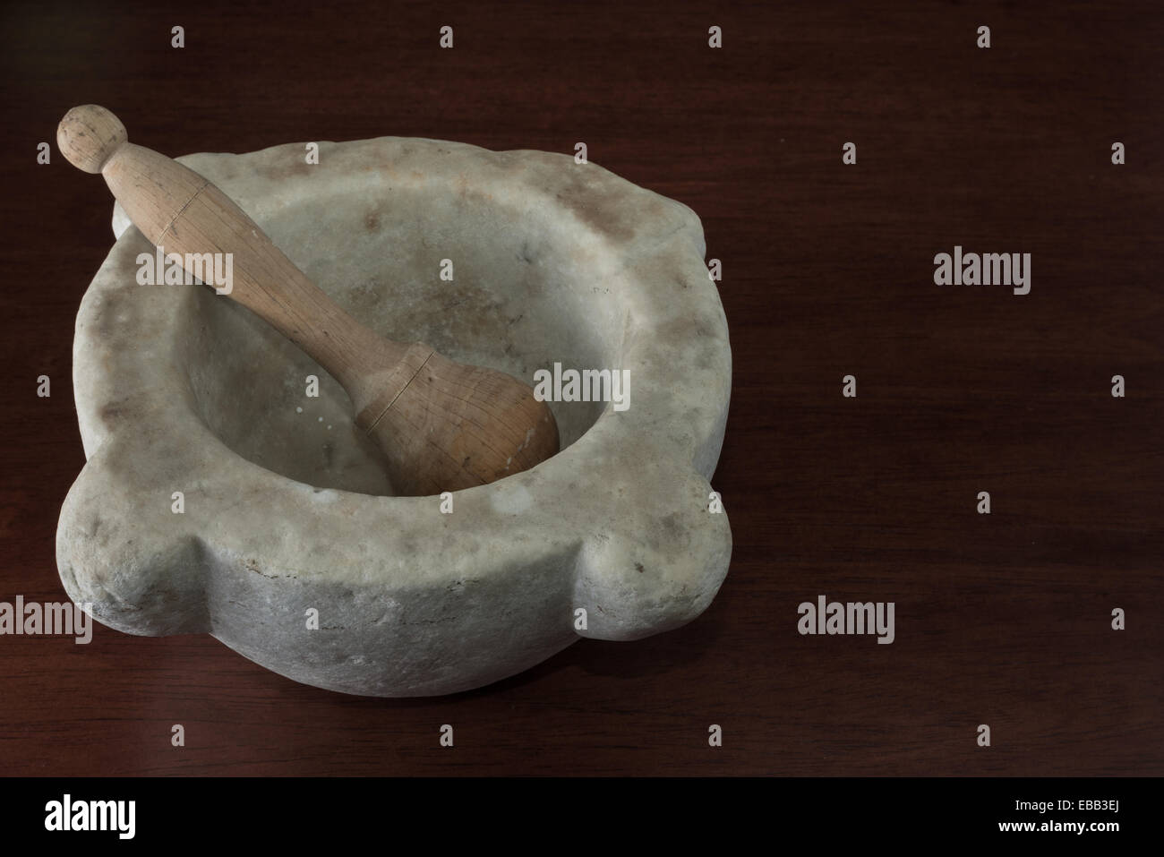 Ancient Marble mortar on a wood table Stock Photo - Alamy