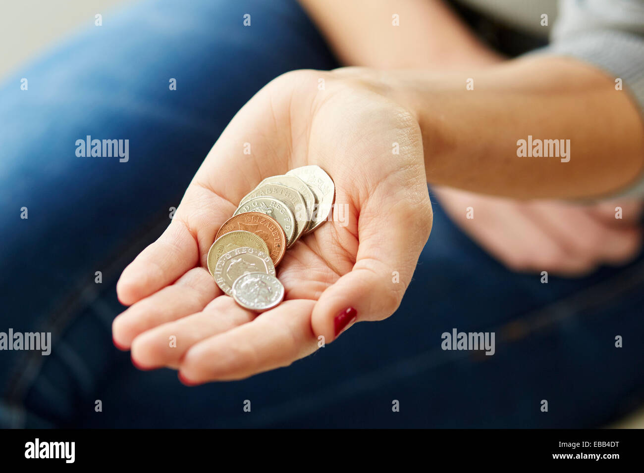Handful of money Stock Photo - Alamy