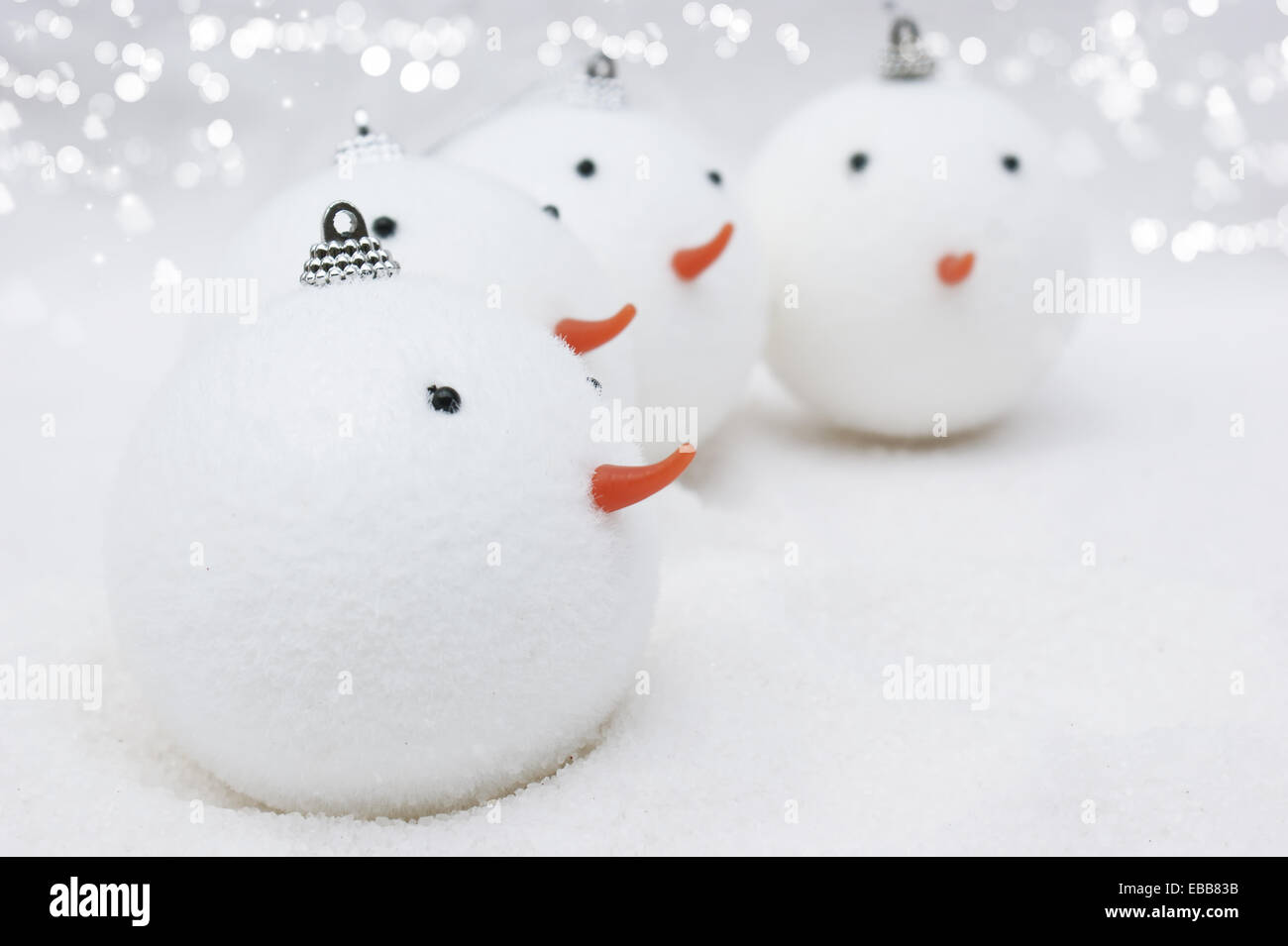 Cute christmas snowmen baubles in snow Stock Photo - Alamy