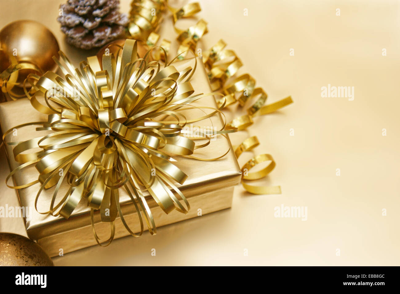 Gold Christmas background with gift and decorations Stock Photo - Alamy