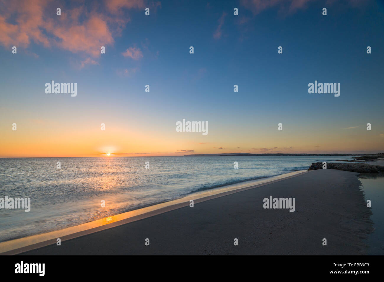 Sunrise on the beach Stock Photo - Alamy