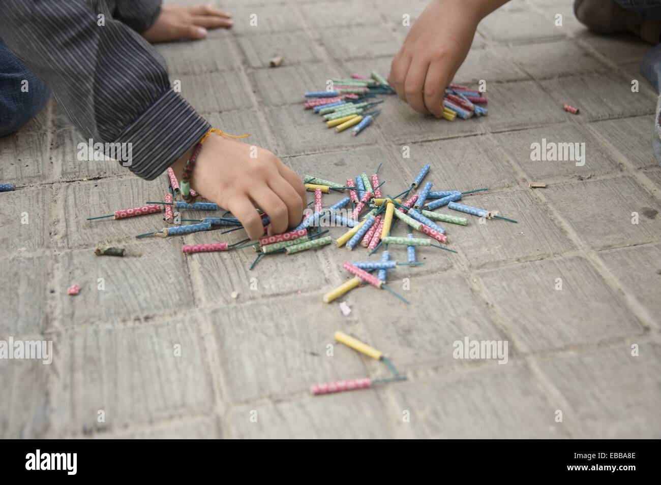 Children playing with firecrackers hi-res stock photography and images ...