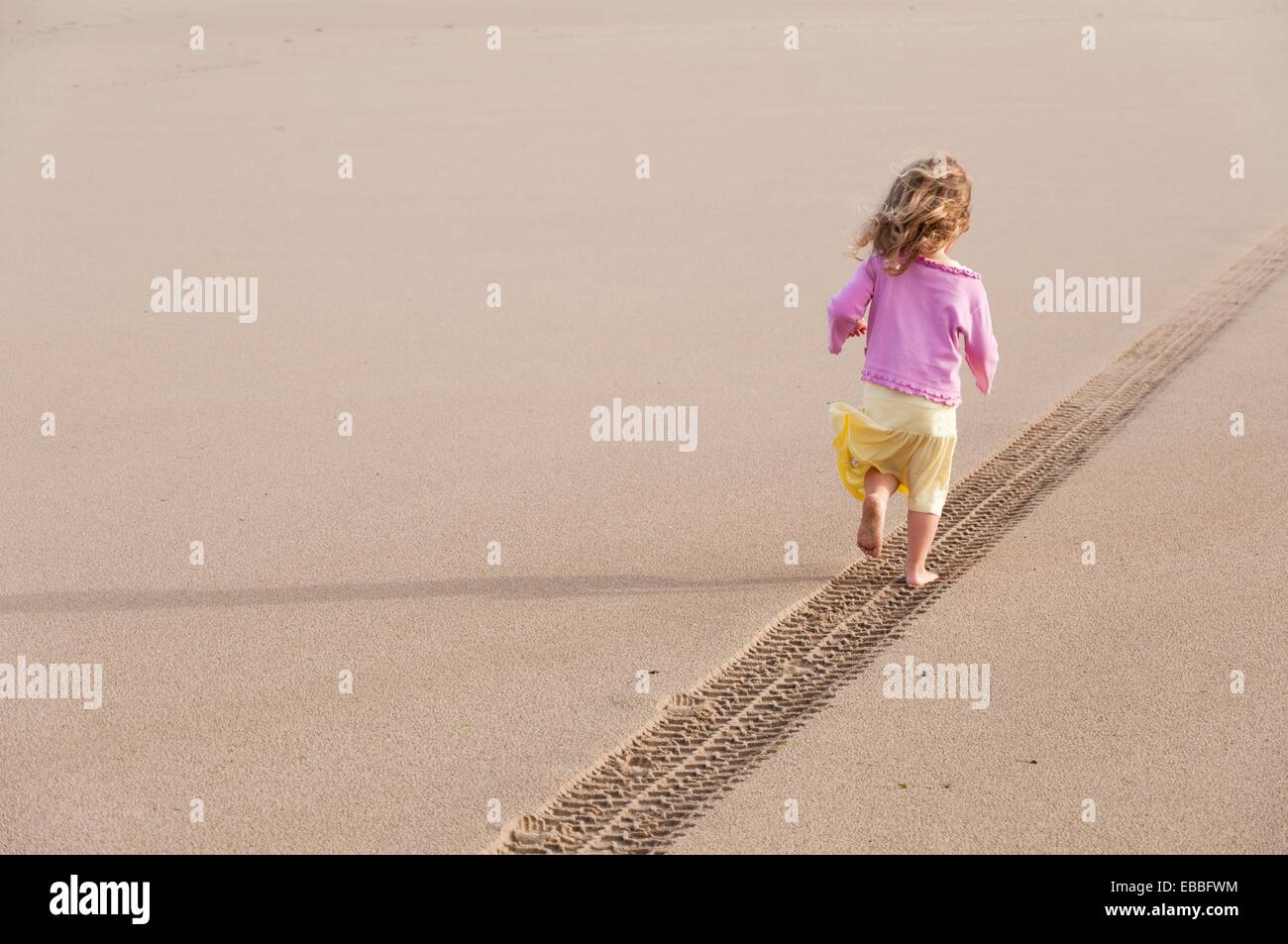 Child running on path rear view hi-res stock photography and images - Alamy