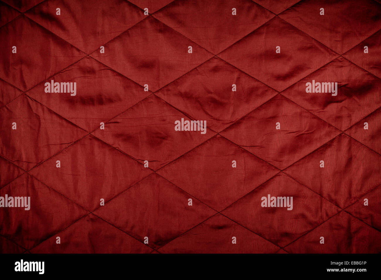 Red quilted material texture Stock Photo - Alamy