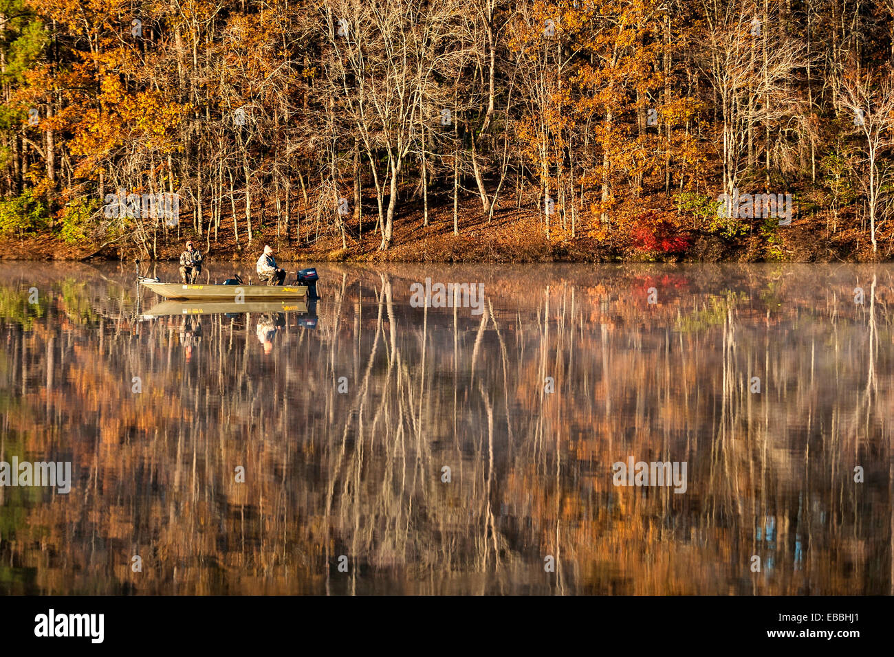 A couple fishermen enjoy a beautiful fall day on Lamar Lake Stock Photo ...