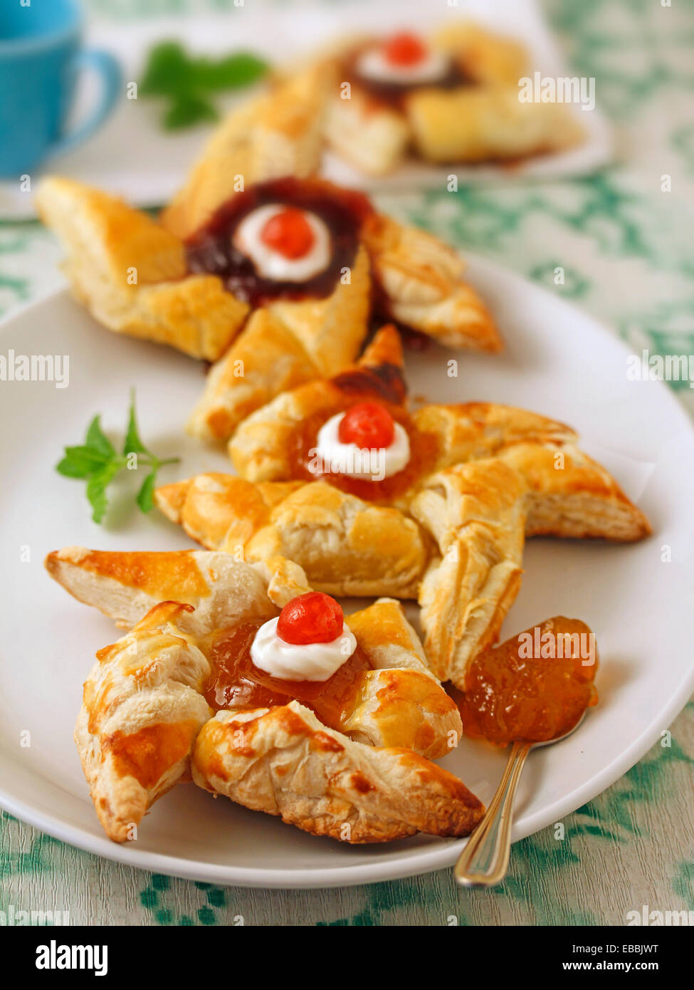 Puff pastry windmills with jams. Recipe available Stock Photo - Alamy