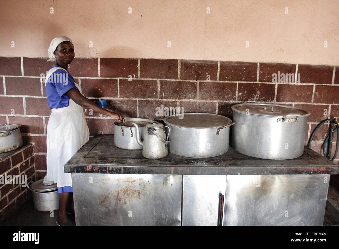 Woman cooking in a school, Maputo, Mozambique, Africa Stock Photo - Alamy