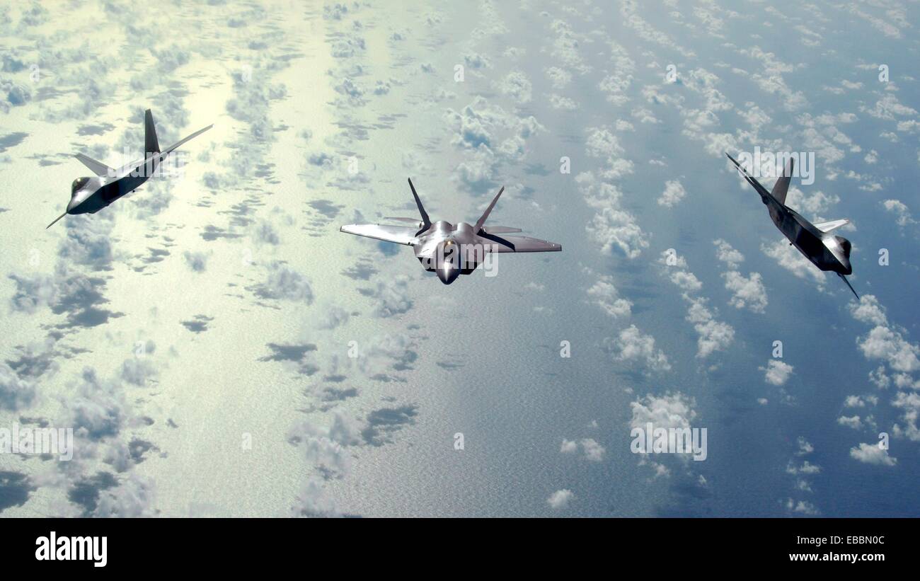A Three ship Formation Of F 22 Raptors Flies Over The Pacific Ocean Jan a-three-ship-formation-of-f-22-raptors-flies-over-the-pacific-ocean-jan