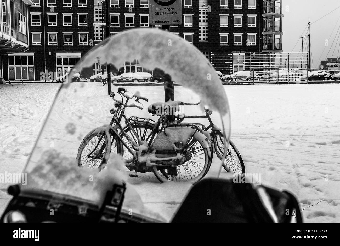 Snowy square seen through bicycle wind screen Stock Photo - Alamy