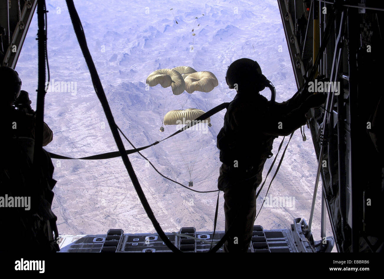 A C-130 Hercules loadmaster observes Improved Container Delivery System ...