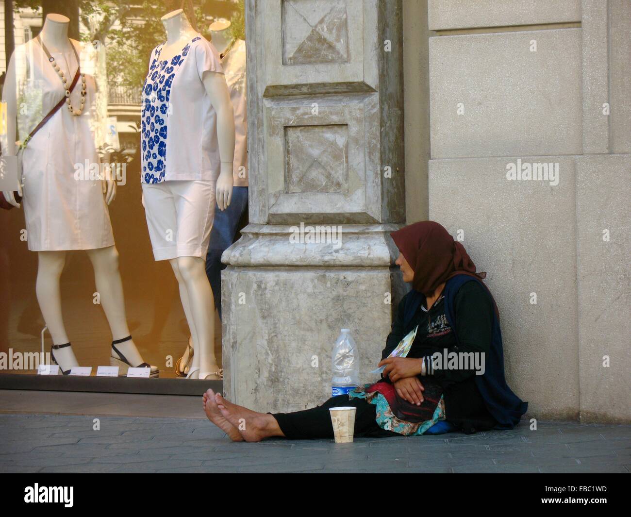Barefoot homeless woman hi-res stock photography and images - Alamy