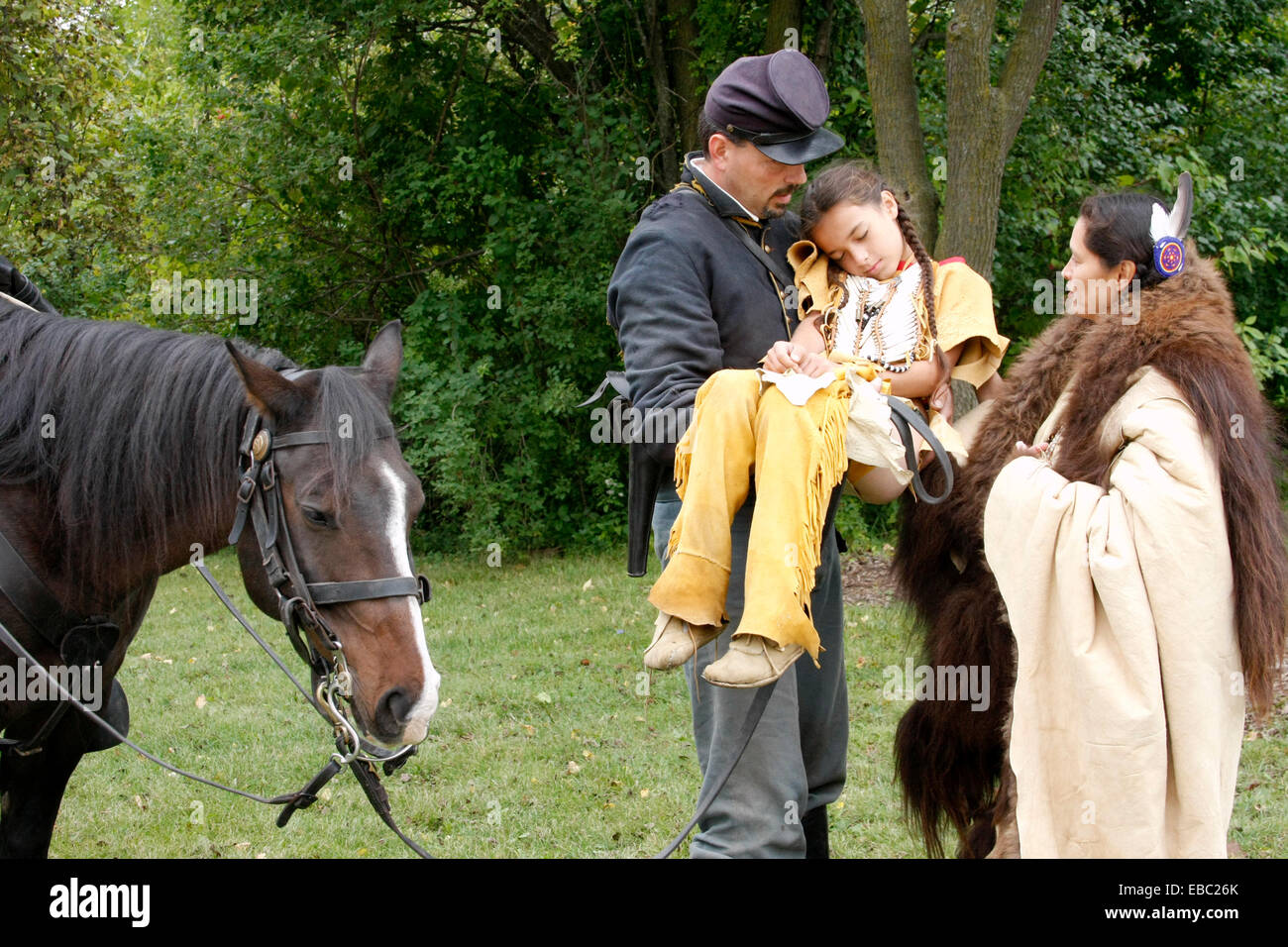 A Civil War Union Soldier returning a young Native American Indian boy ...
