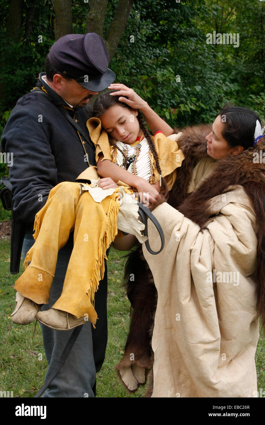 A Civil War Union Soldier returning a young Native American Indian boy ...