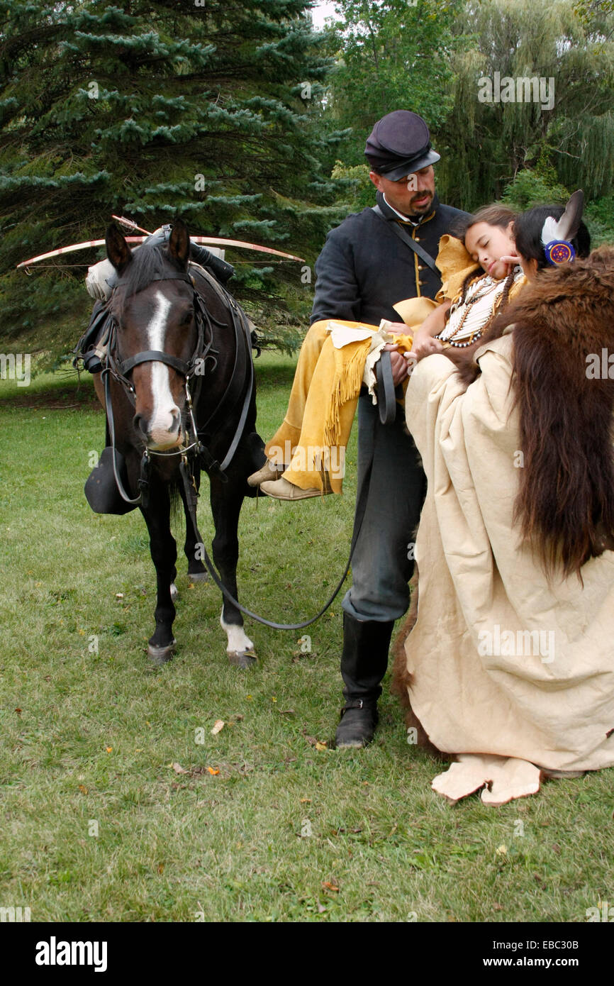A Civil War Union Soldier returning a young Native American Indian boy ...
