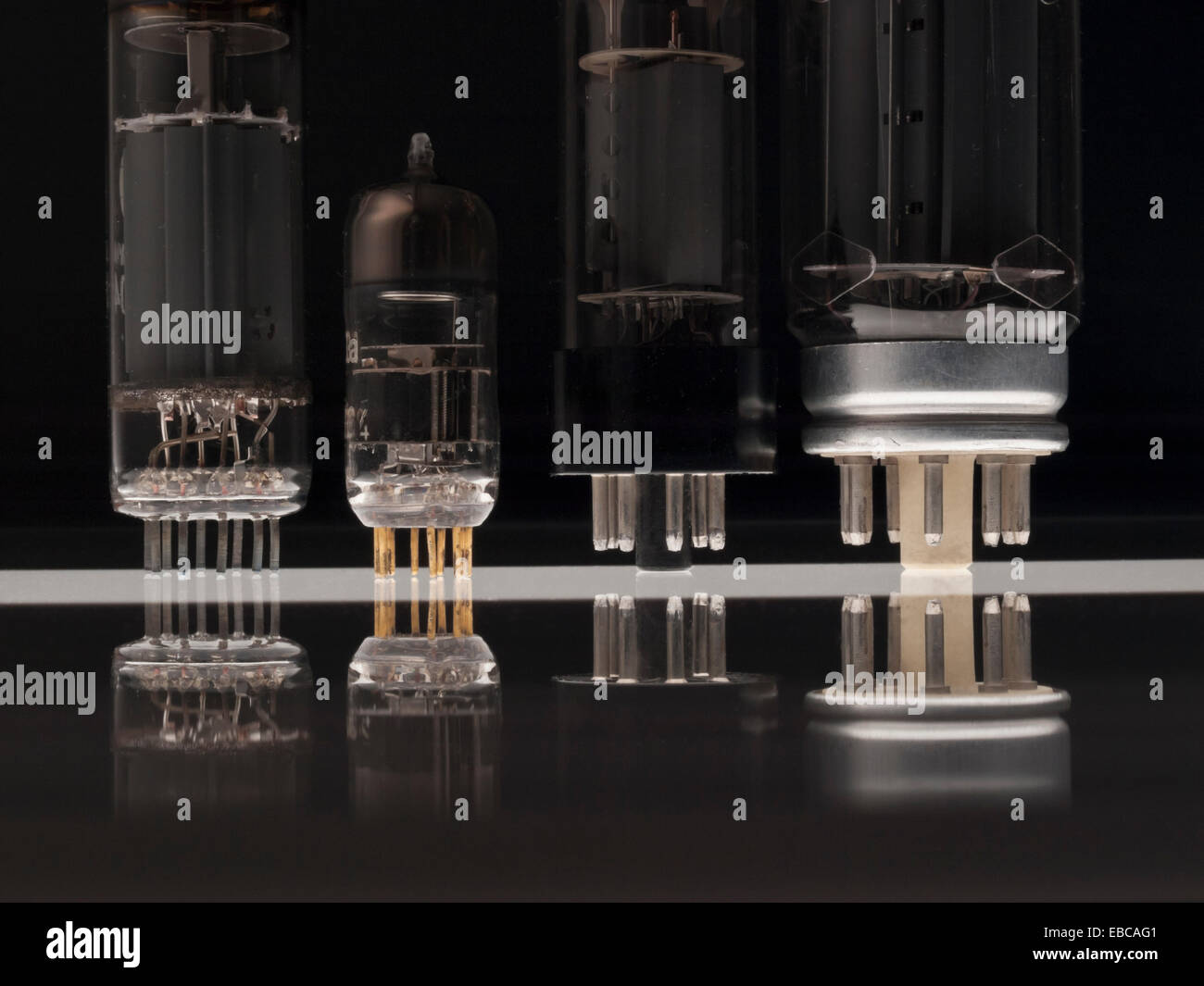 Vacuum tubes on black background with reflection Stock Photo - Alamy