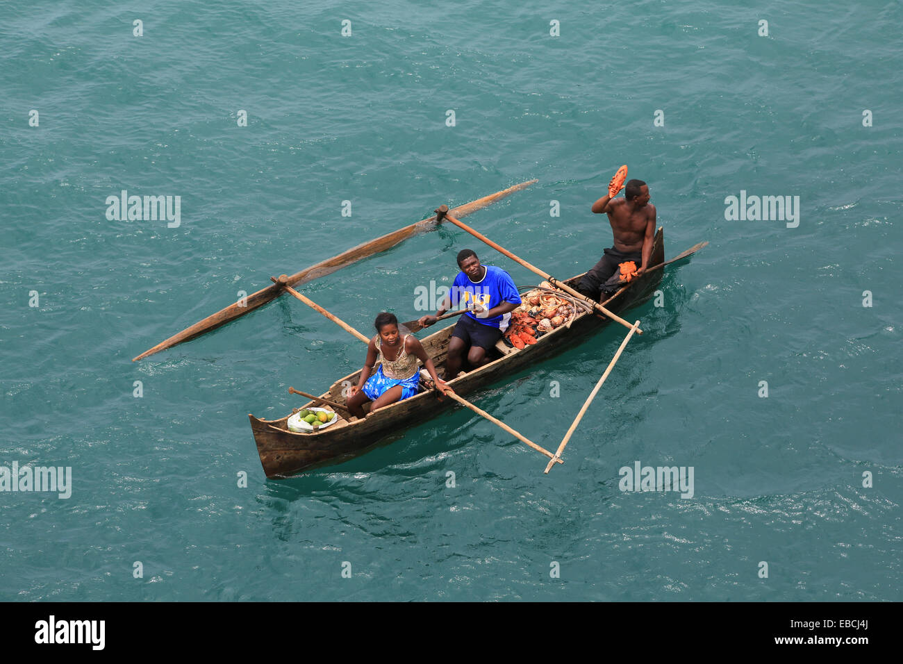 Native in outrigger canoe hi-res stock photography and images - Alamy