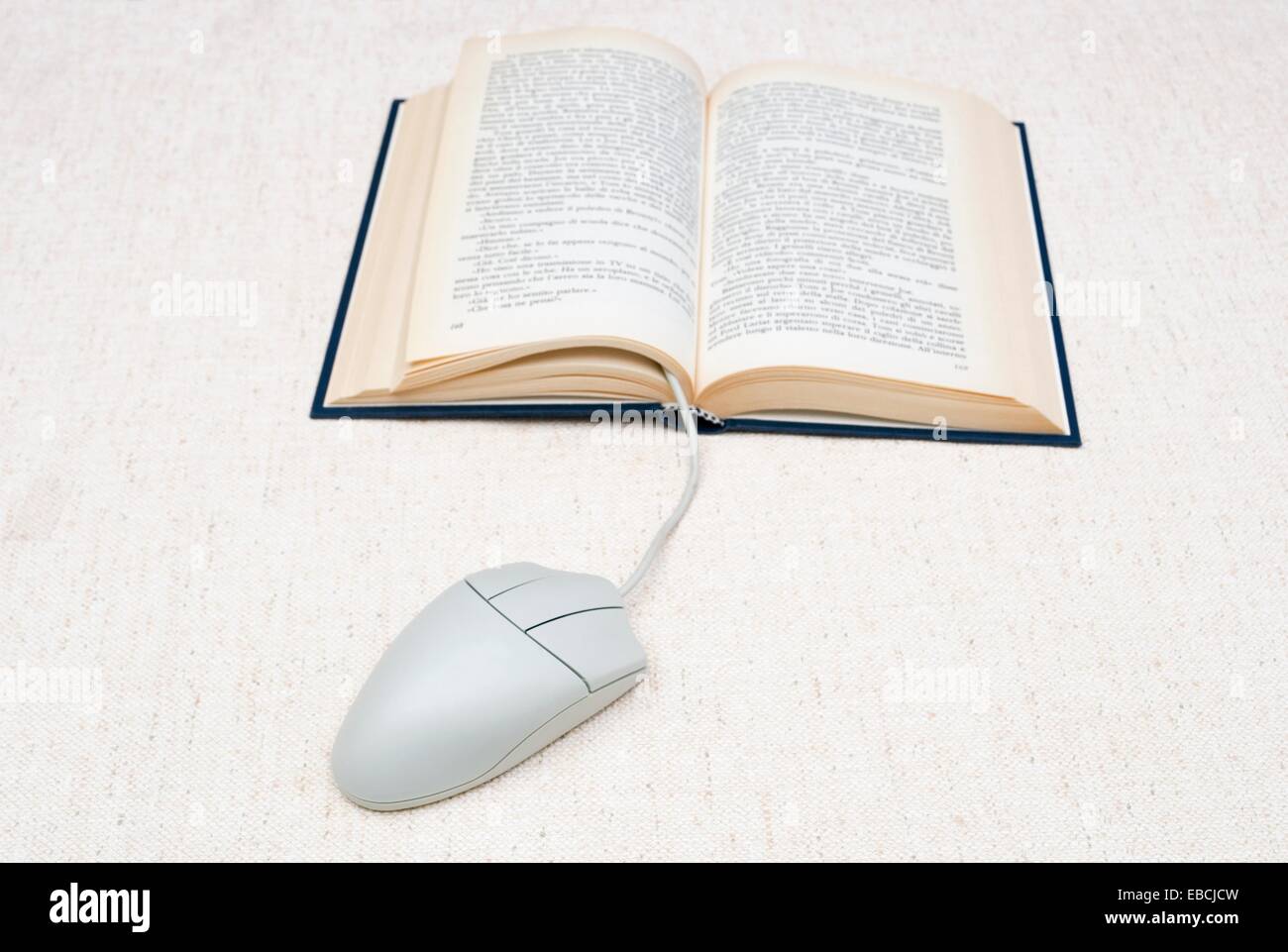 Computer mouse and book Stock Photo - Alamy