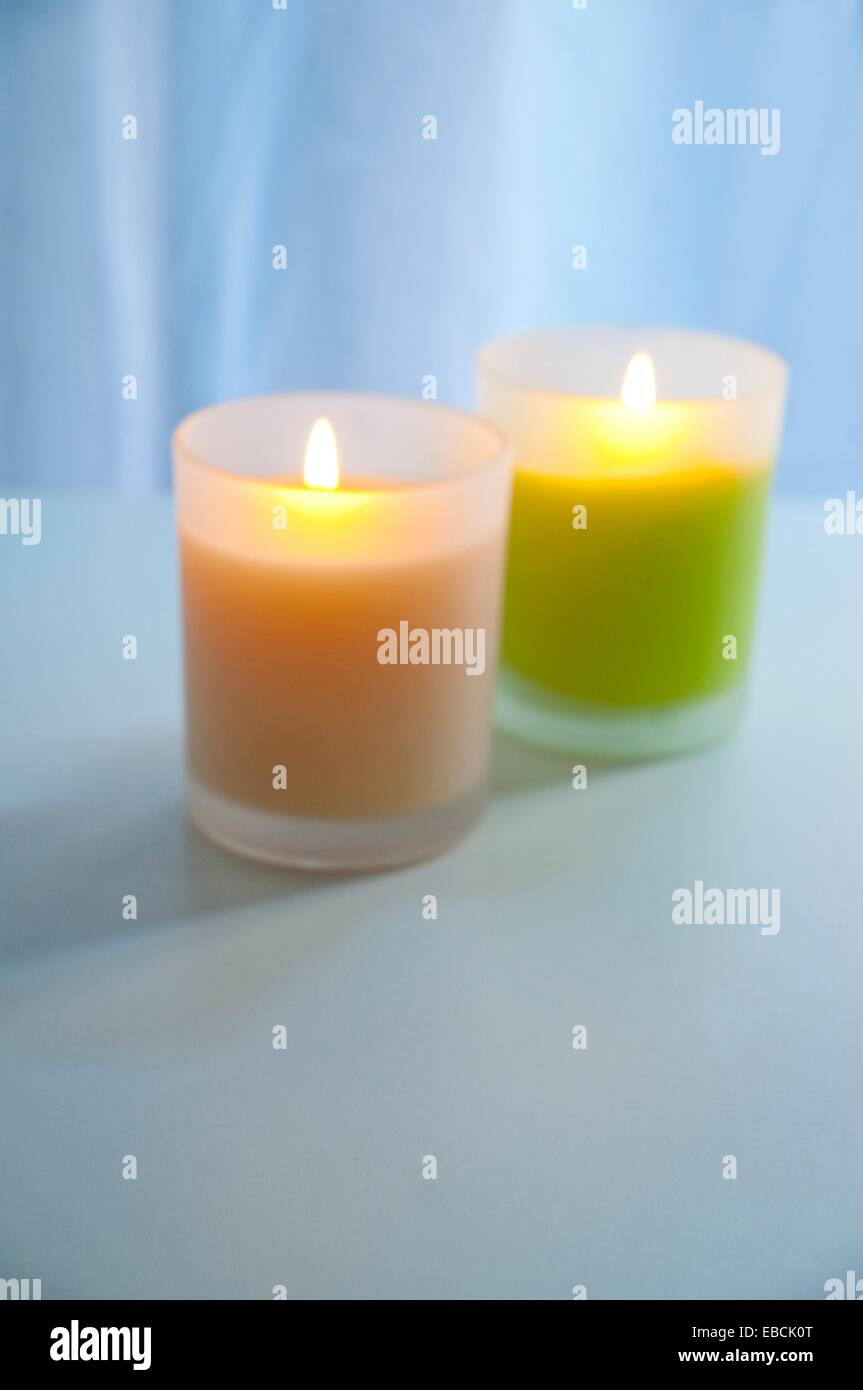 Two lit up candles Stock Photo - Alamy